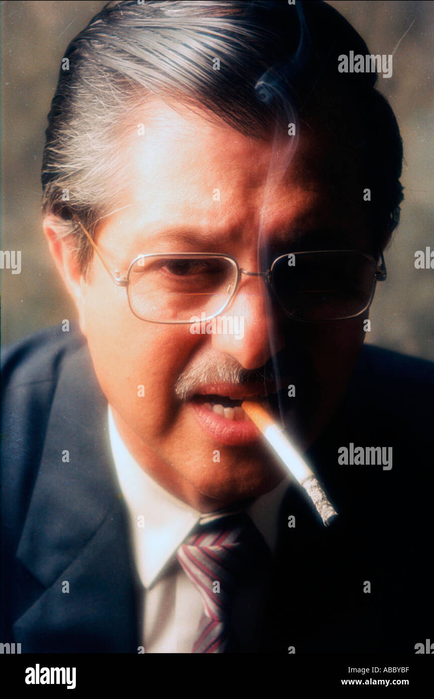 SSA70213 Old man Pesi wearing Tie suit smoking a cigarette Stock Photo ...