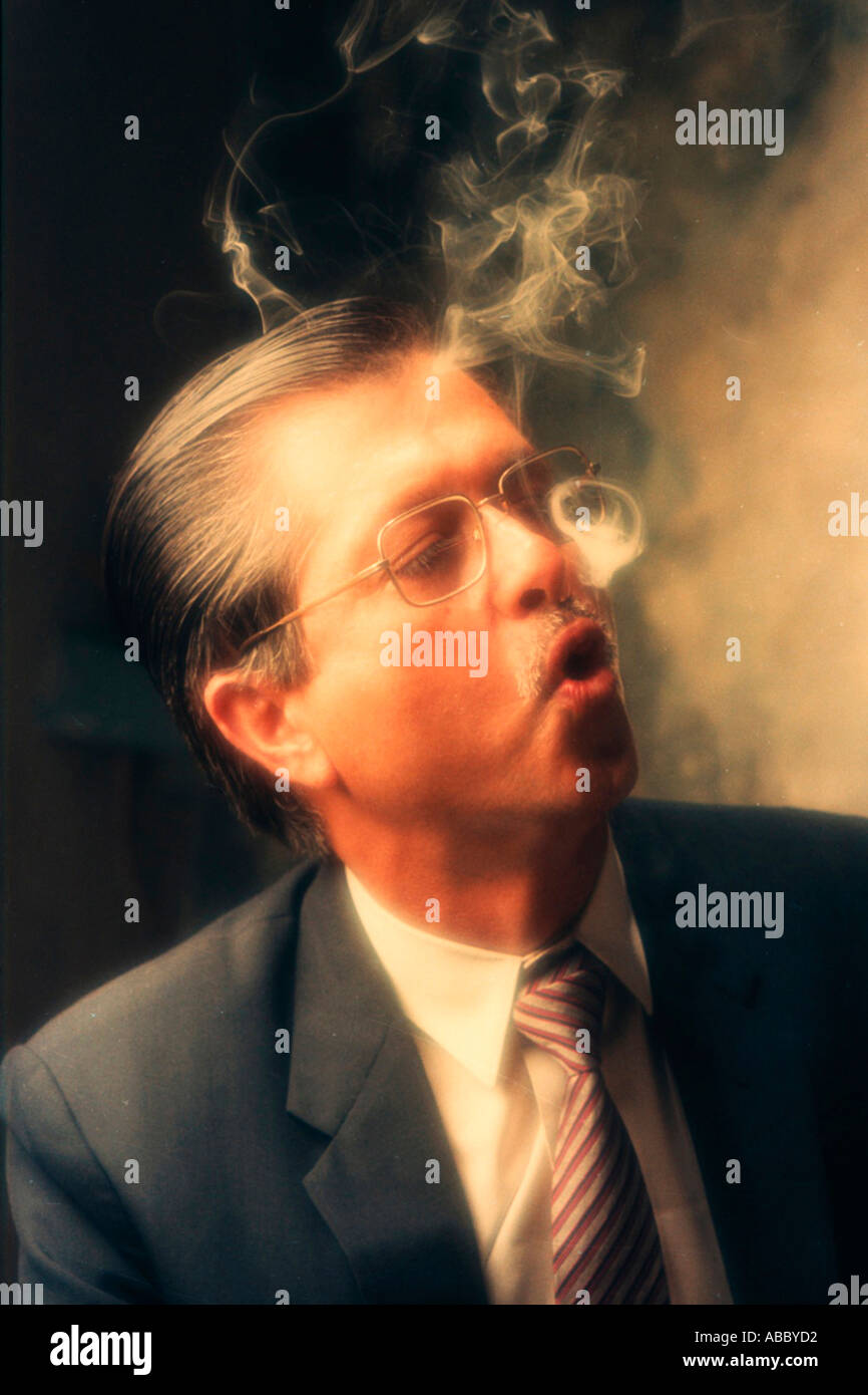 SSA70217 Old man Pesi wearing tie suit smoking blowing smoke rings ...