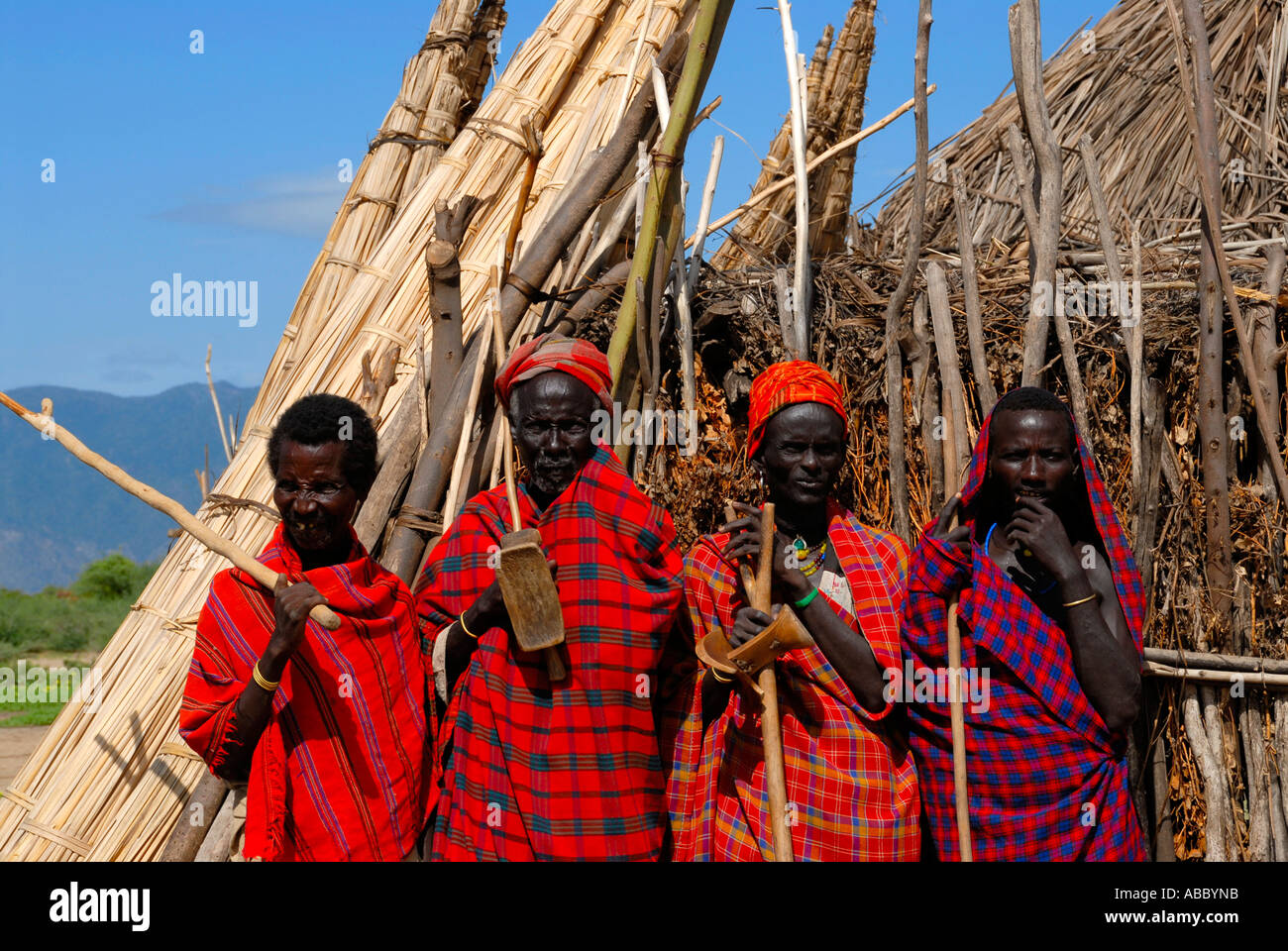 Four men chiefs elders of the Arbore people dressed in red capes in ...