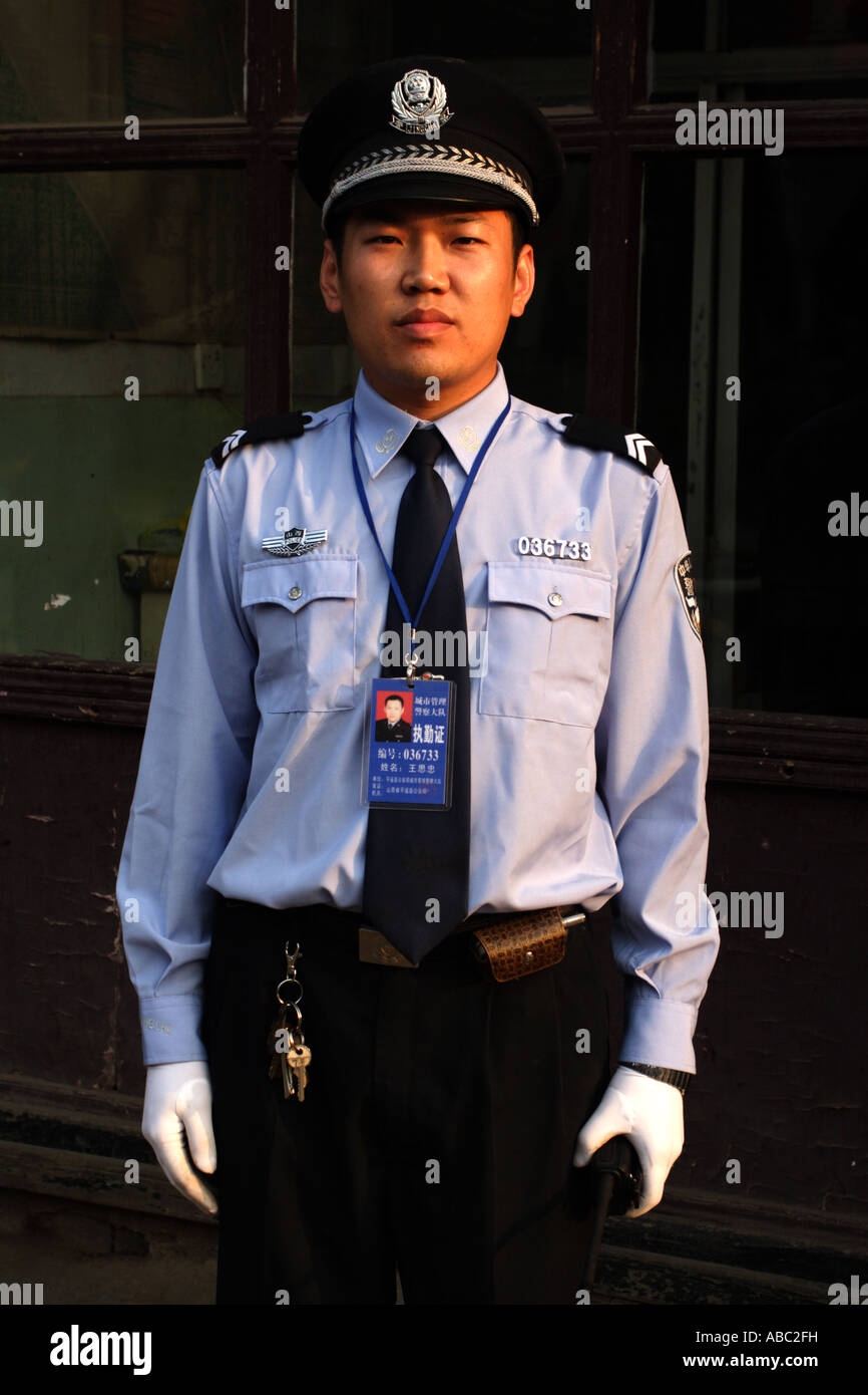 A police officer stands to attention in Pingyao, China Stock Photo - Alamy