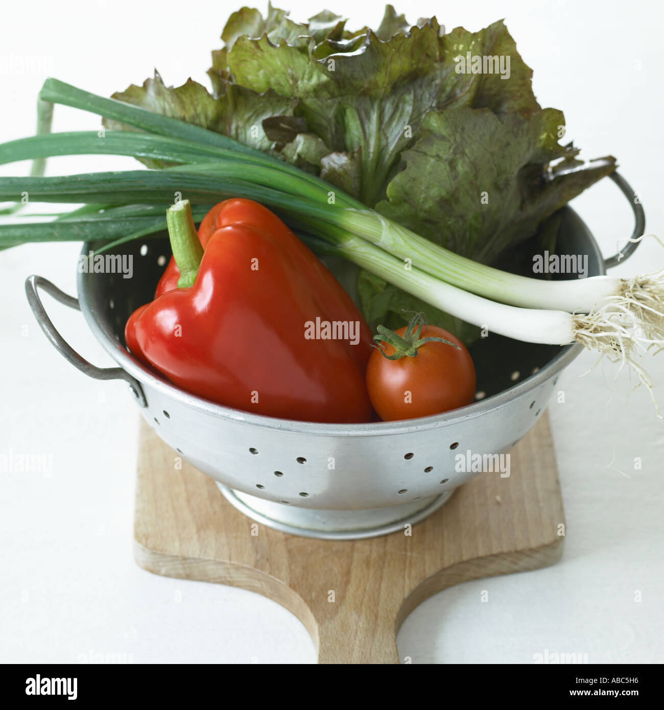 Salad vegetables in colander Stock Photo - Alamy