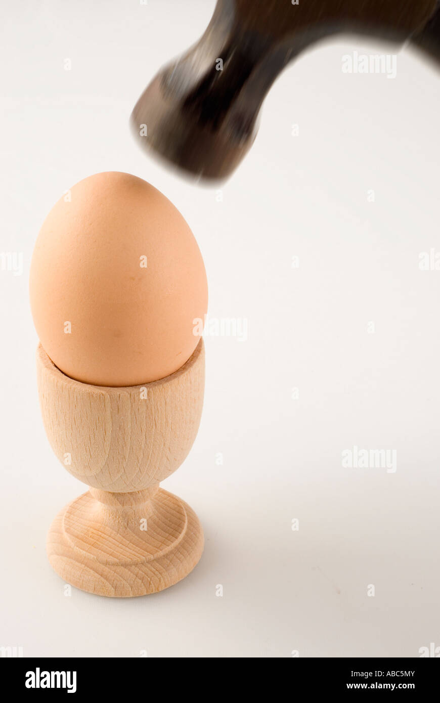 Hammer used to smash boiled egg Stock Photo - Alamy