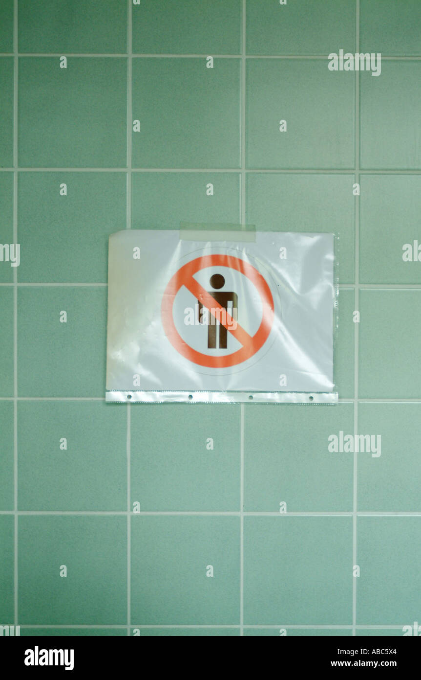 Prohibition sign A4 in plastic on green tiled wall Stock Photo - Alamy