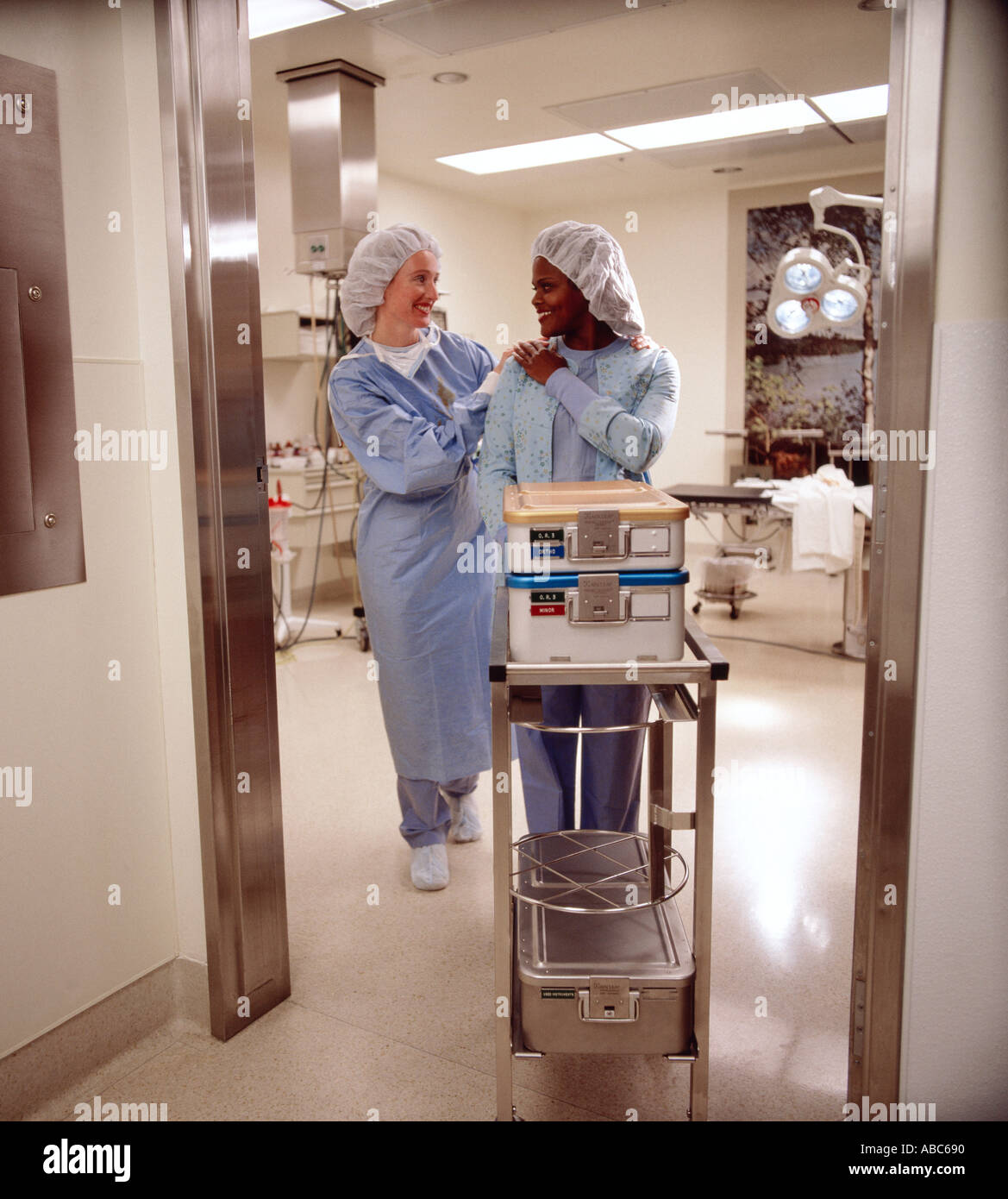 Medical - Two surgical nurses leave an operating room congratulating ...