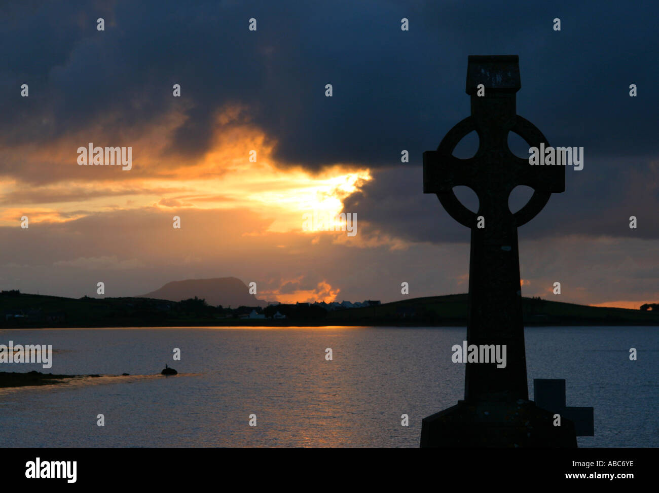 Celtic cross at sunset Stock Photo - Alamy