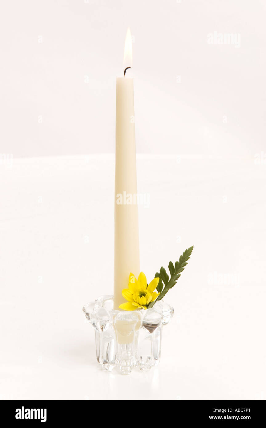 Candle with flower arrangement Stock Photo - Alamy