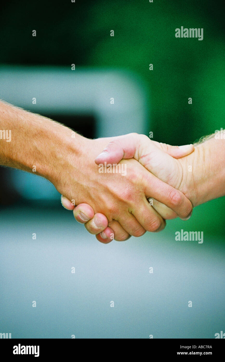 Men clasp hands hi-res stock photography and images - Alamy