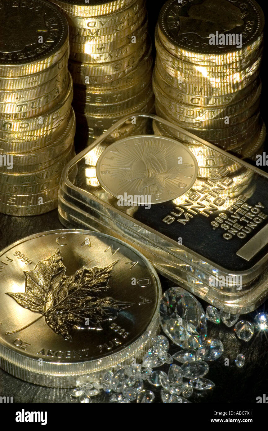 Pound coins; silver coins and bullion; diamonds Stock Photo - Alamy