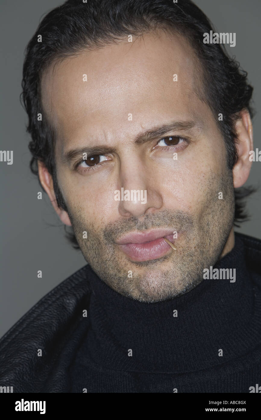 Man with toothpick in his mouth hi-res stock photography and images - Alamy