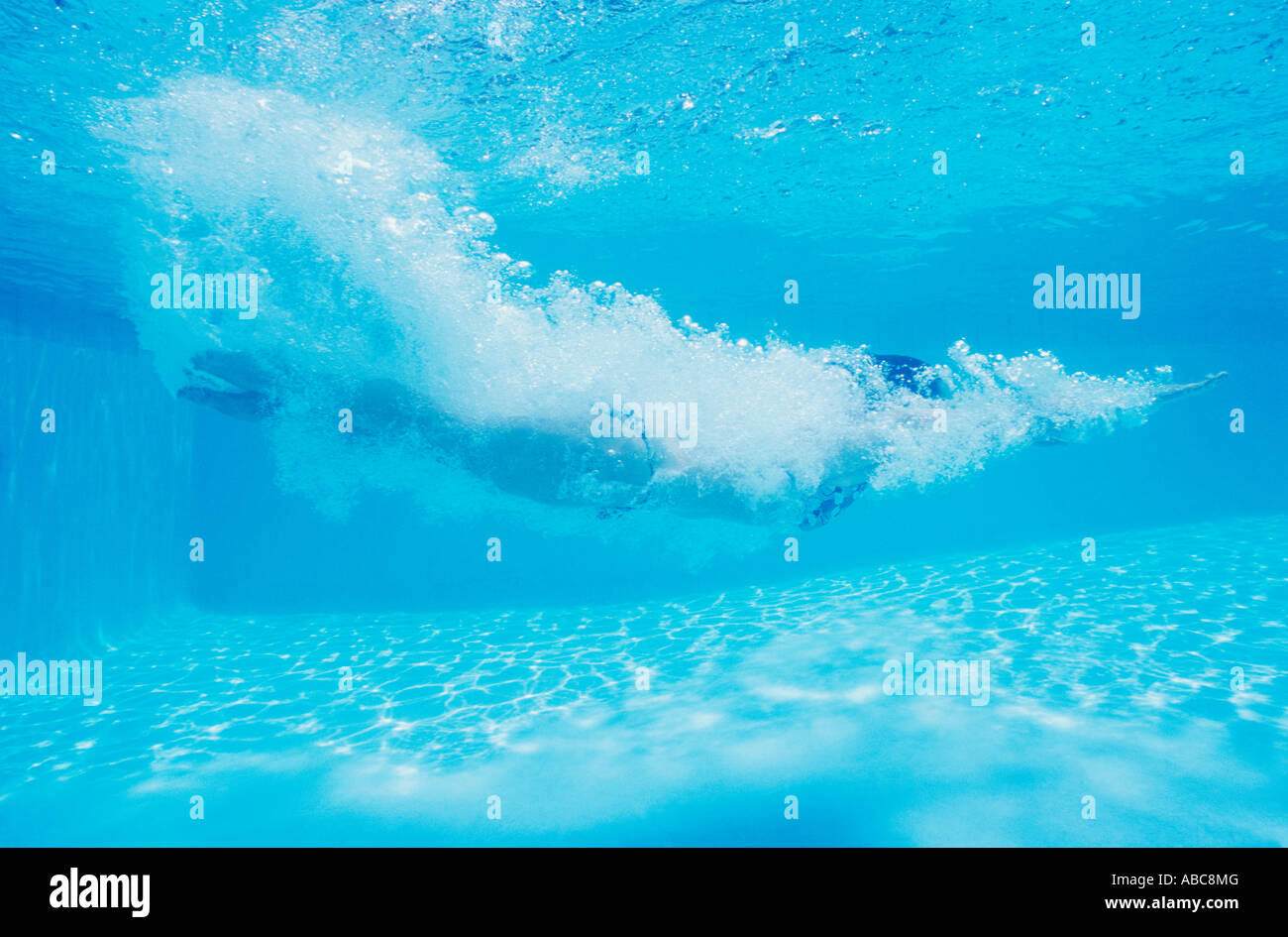 Woman diving into pool photographed from underwater Stock Photo - Alamy