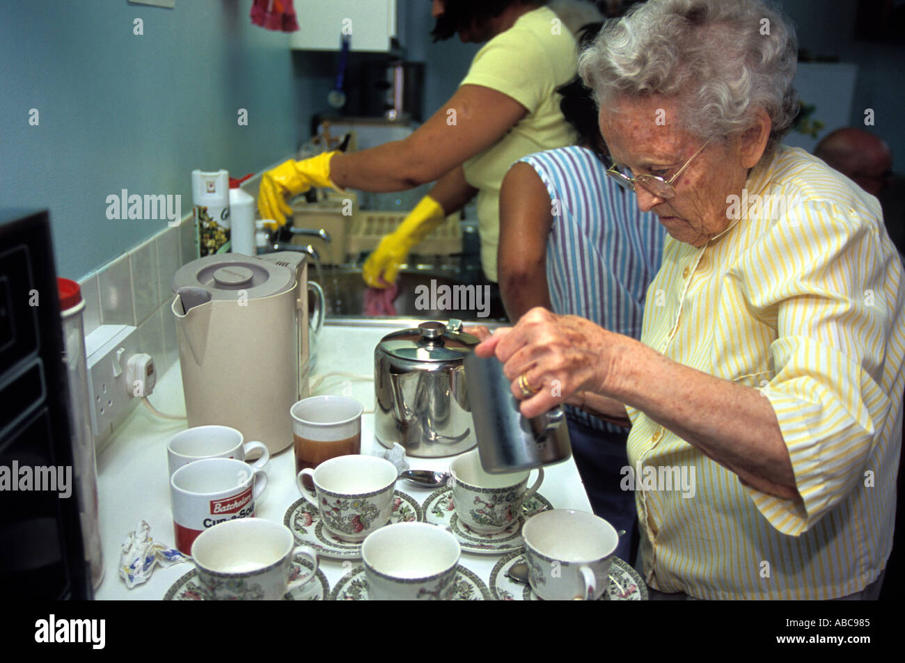 Elderly woman making tea in sheltered housing, Lambeth UK Stock Photo ...