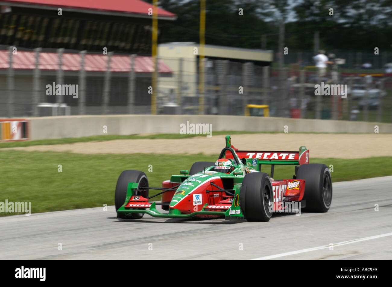 Adrian Fernandez races at down the front straight at the Champ Car ...