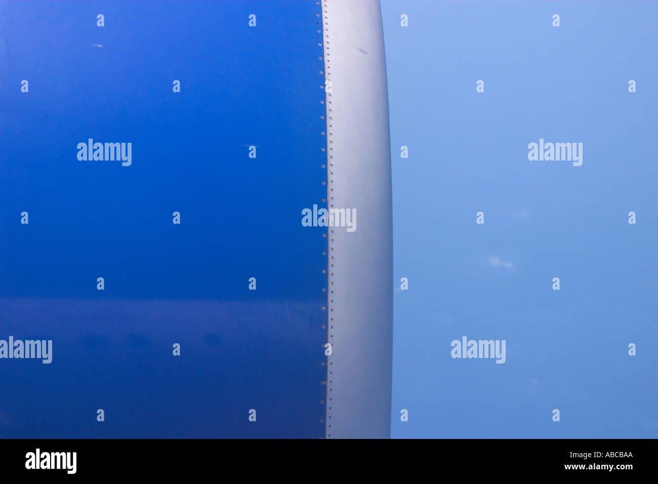 Blue jet engine against blue sky Stock Photo - Alamy