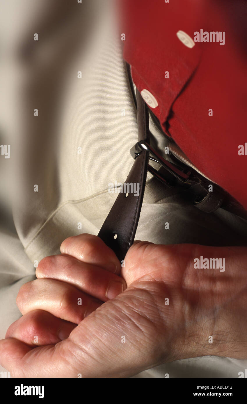 Tight belt hi-res stock photography and images - Alamy