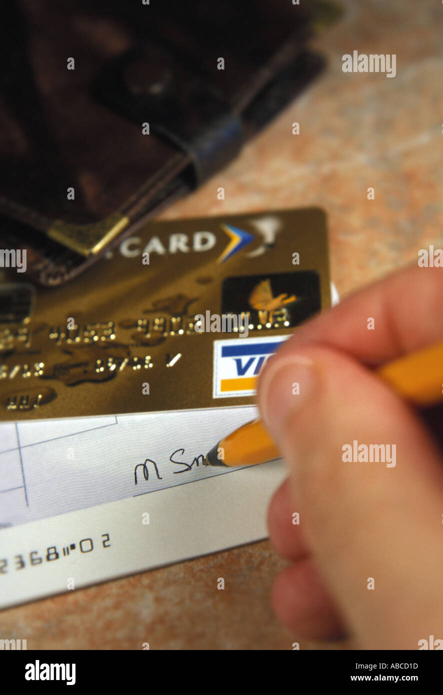 signing bank cheque Stock Photo - Alamy