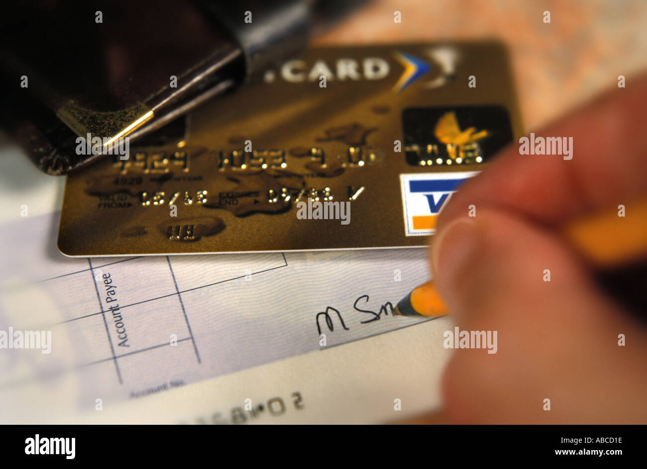 signing a bank cheque Stock Photo - Alamy