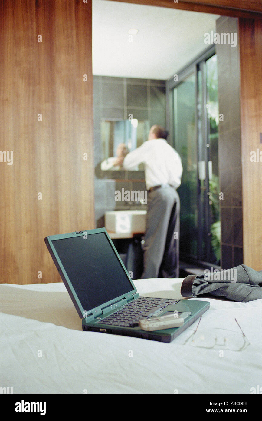 Laptop on a bed Stock Photo - Alamy