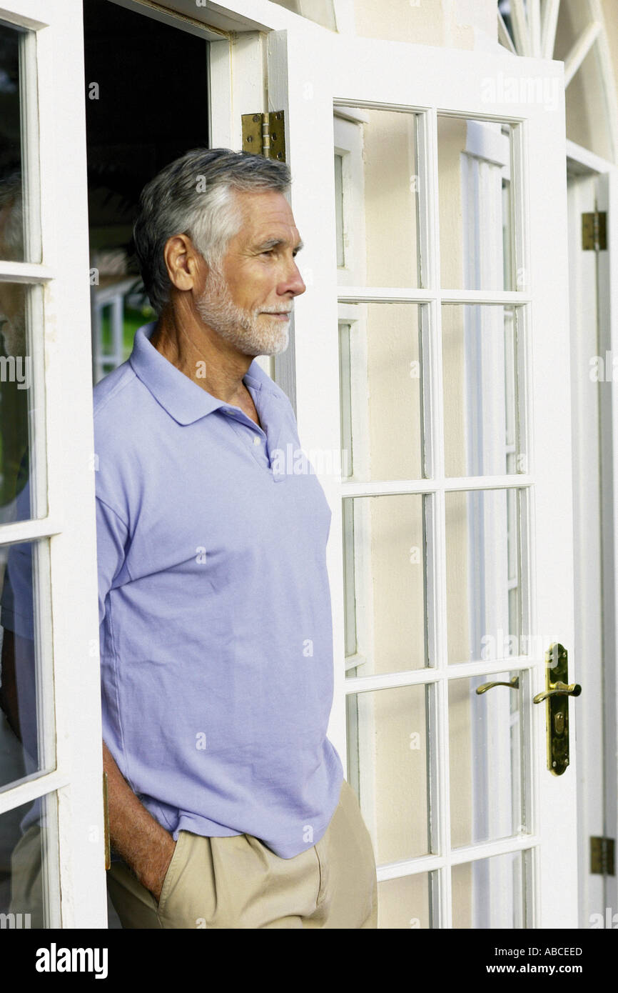 Man standing in doorway Stock Photo - Alamy
