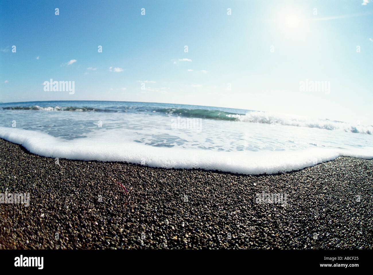 Surf on shingle beach Stock Photo - Alamy