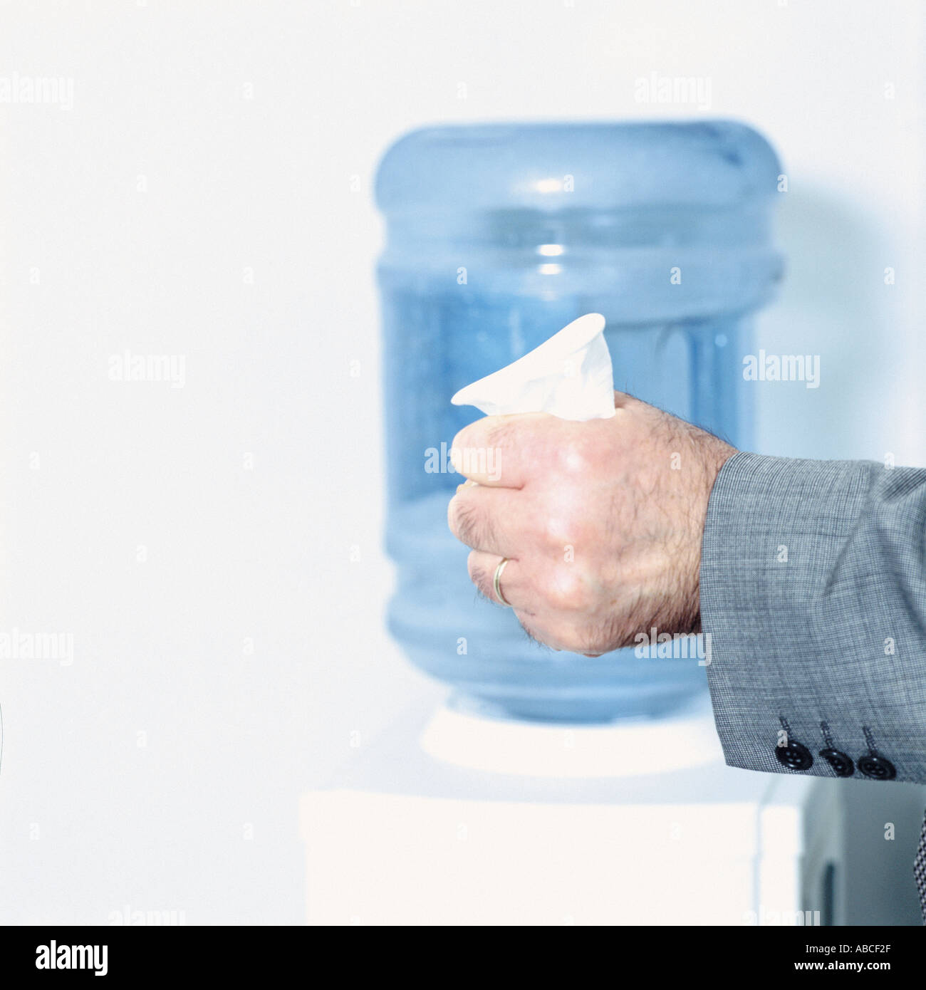 An angry businessman crushing a paper cup Stock Photo - Alamy