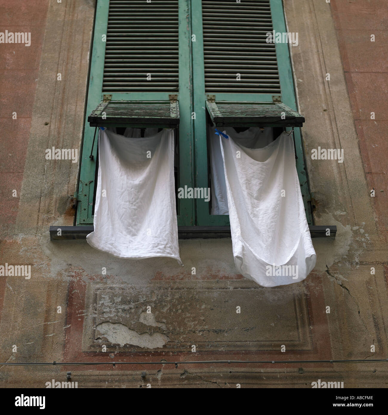 Washing hanging from Italian window Stock Photo - Alamy