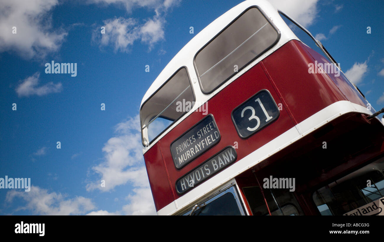 Front of a red number 31 double decker bus against a cloudy blue sky ...