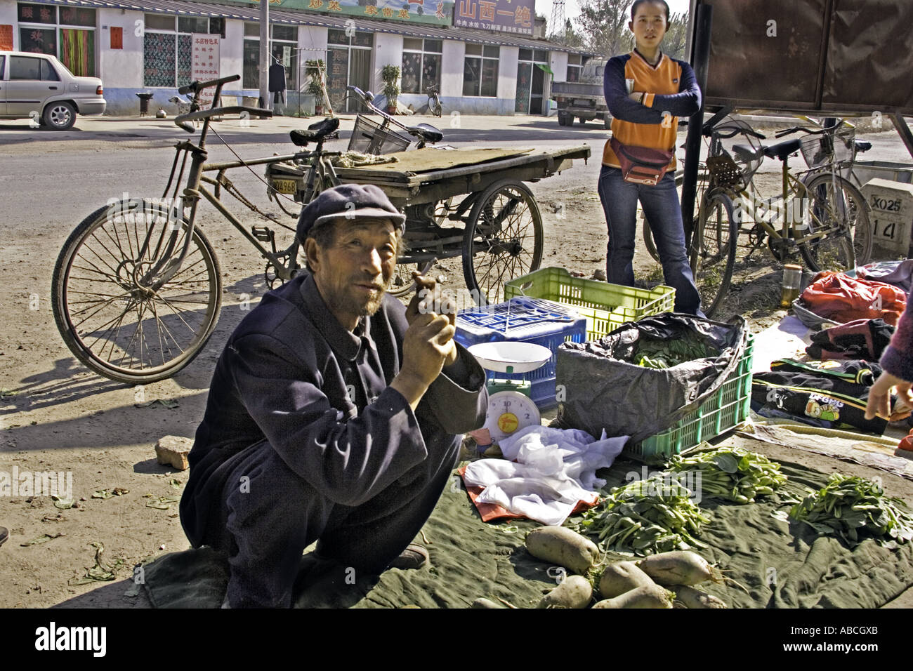 CHINA Beijing Bicycle vendor selling variety of fresh vegetables in ...