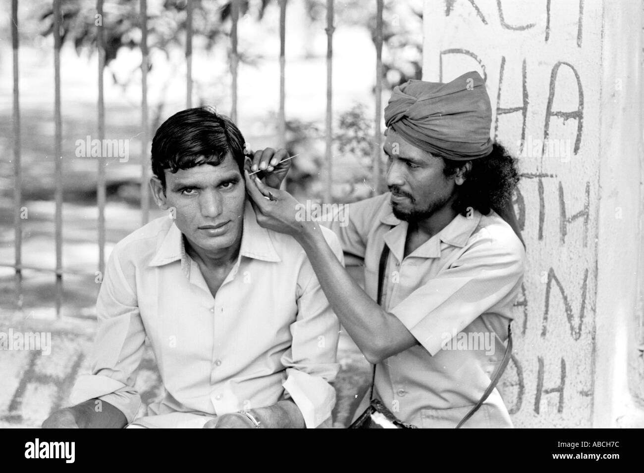 India ear cleaning Black and White Stock Photos & Images - Alamy