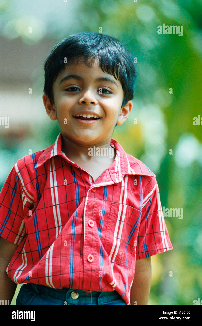 Boy young South Asian Indian child Yash looking to camera with small ...