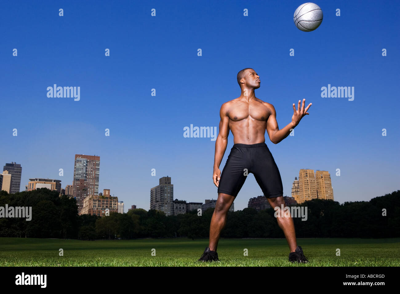 Man throwing basketball Stock Photo - Alamy