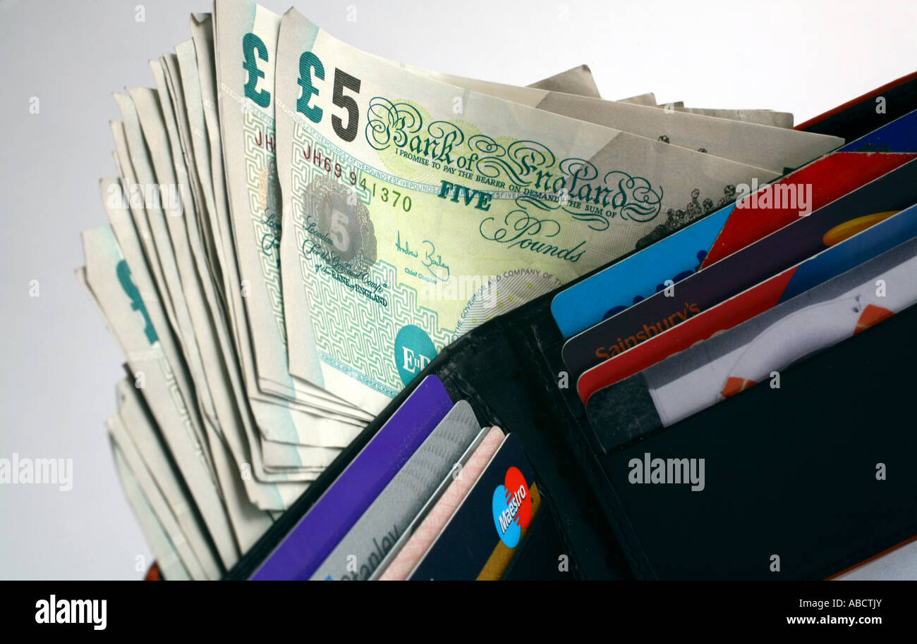 Wallet stuffed with Five Pound Notes Stock Photo - Alamy