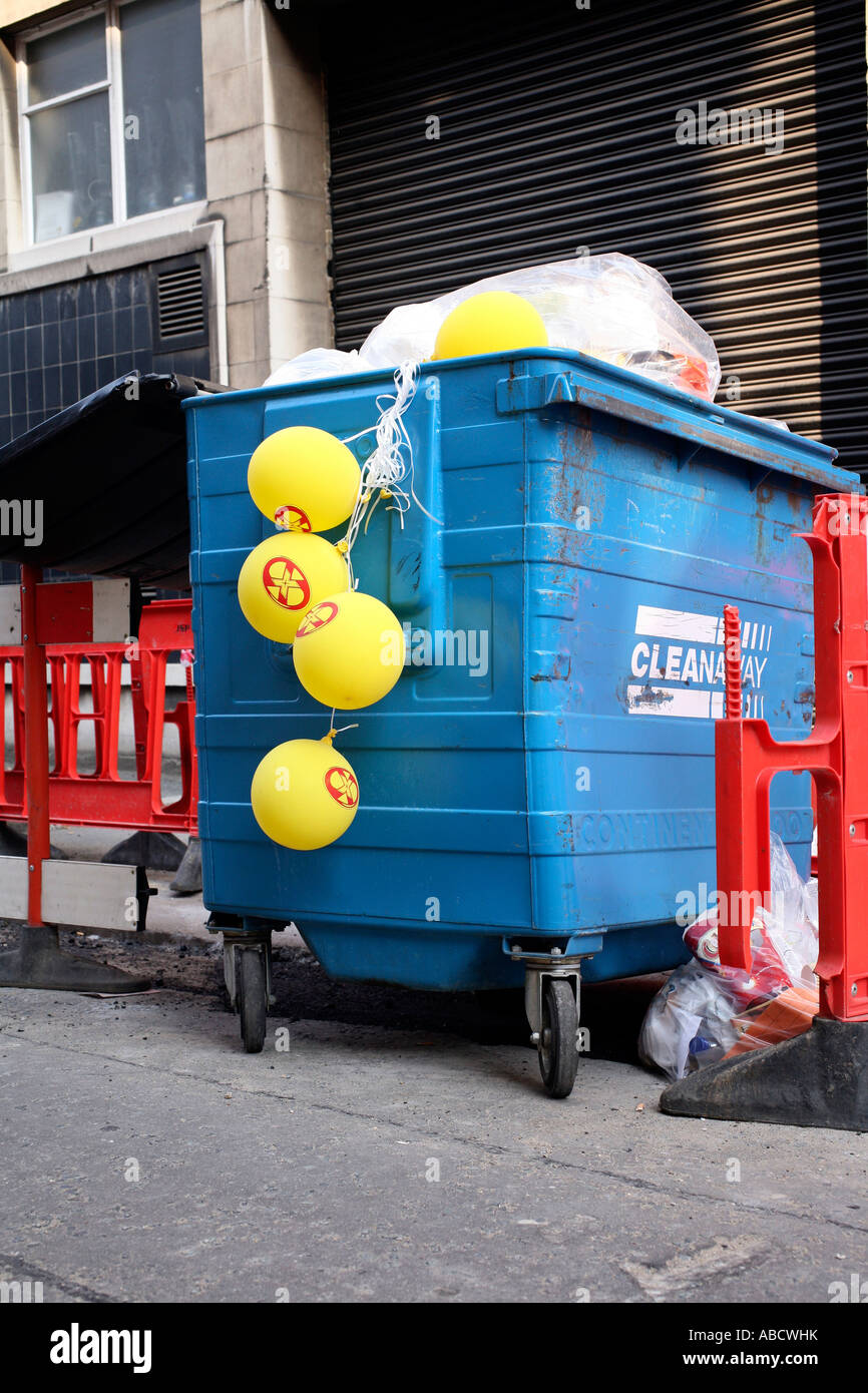 Dumpster with party balloons, Shoreditch, London Stock Photo - Alamy