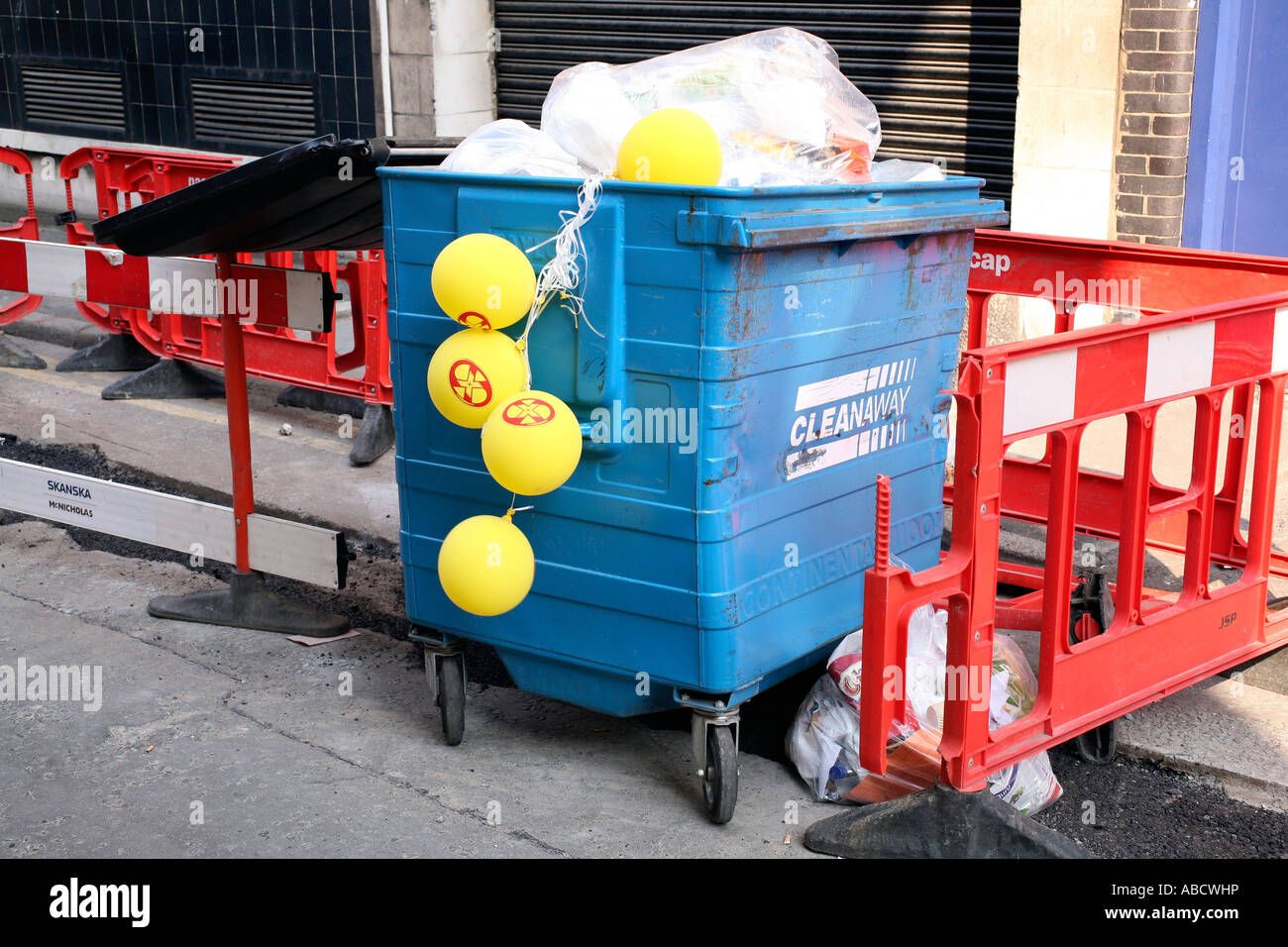 Dumpster with party balloons, Shoreditch, London Stock Photo - Alamy