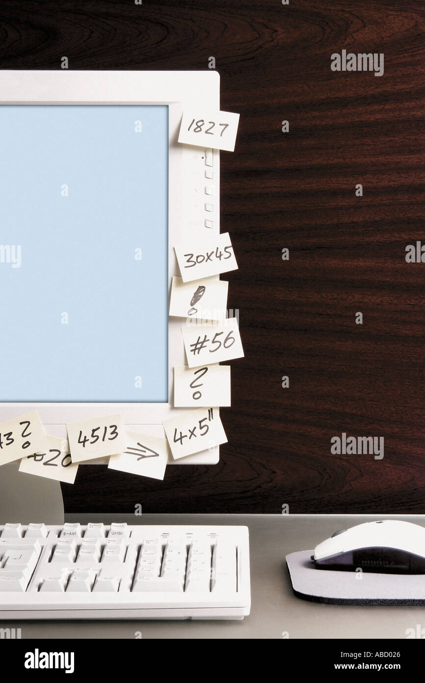 Adhesive notes on a computer Stock Photo - Alamy