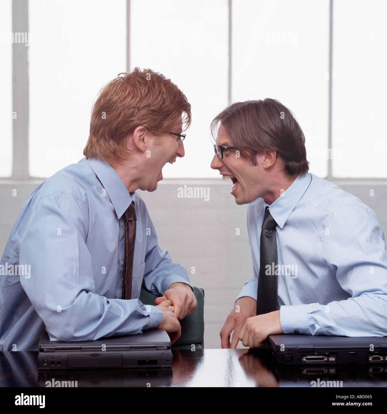 Two businessmen shouting at each other Stock Photo - Alamy