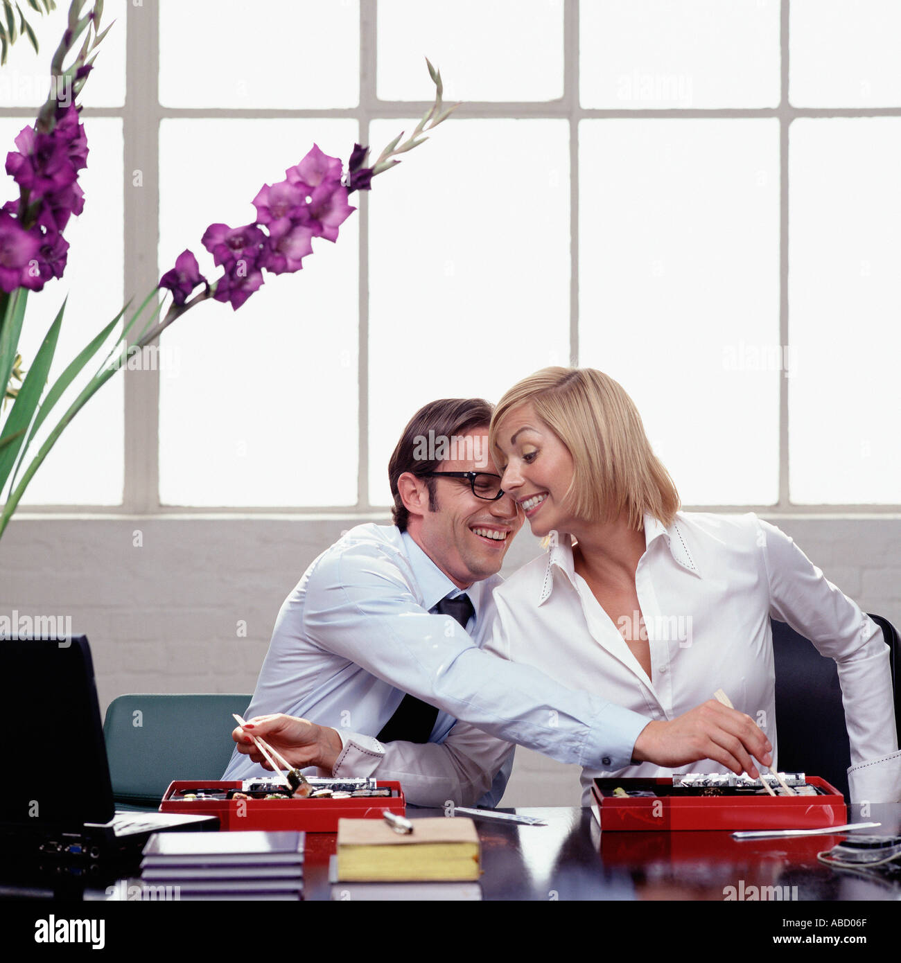 Eating and flirting at work Stock Photo - Alamy