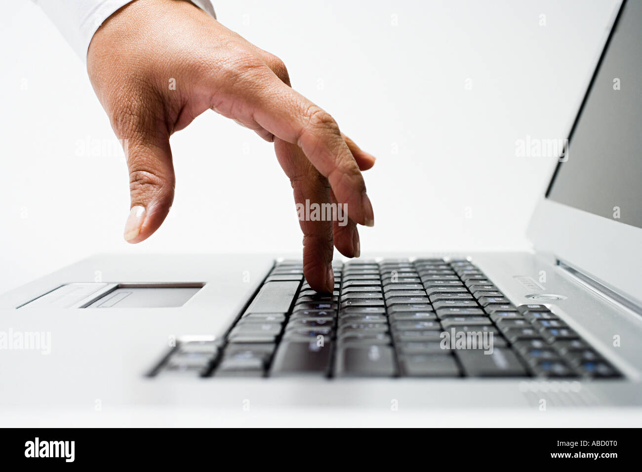 Typing on a laptop Stock Photo - Alamy