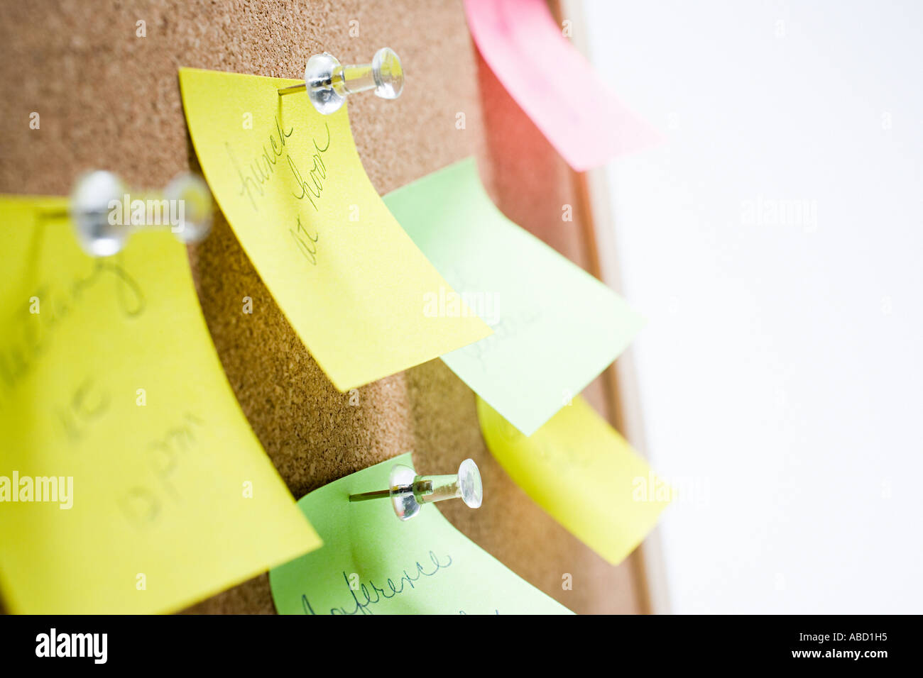 Notes on a bulletin board Stock Photo - Alamy