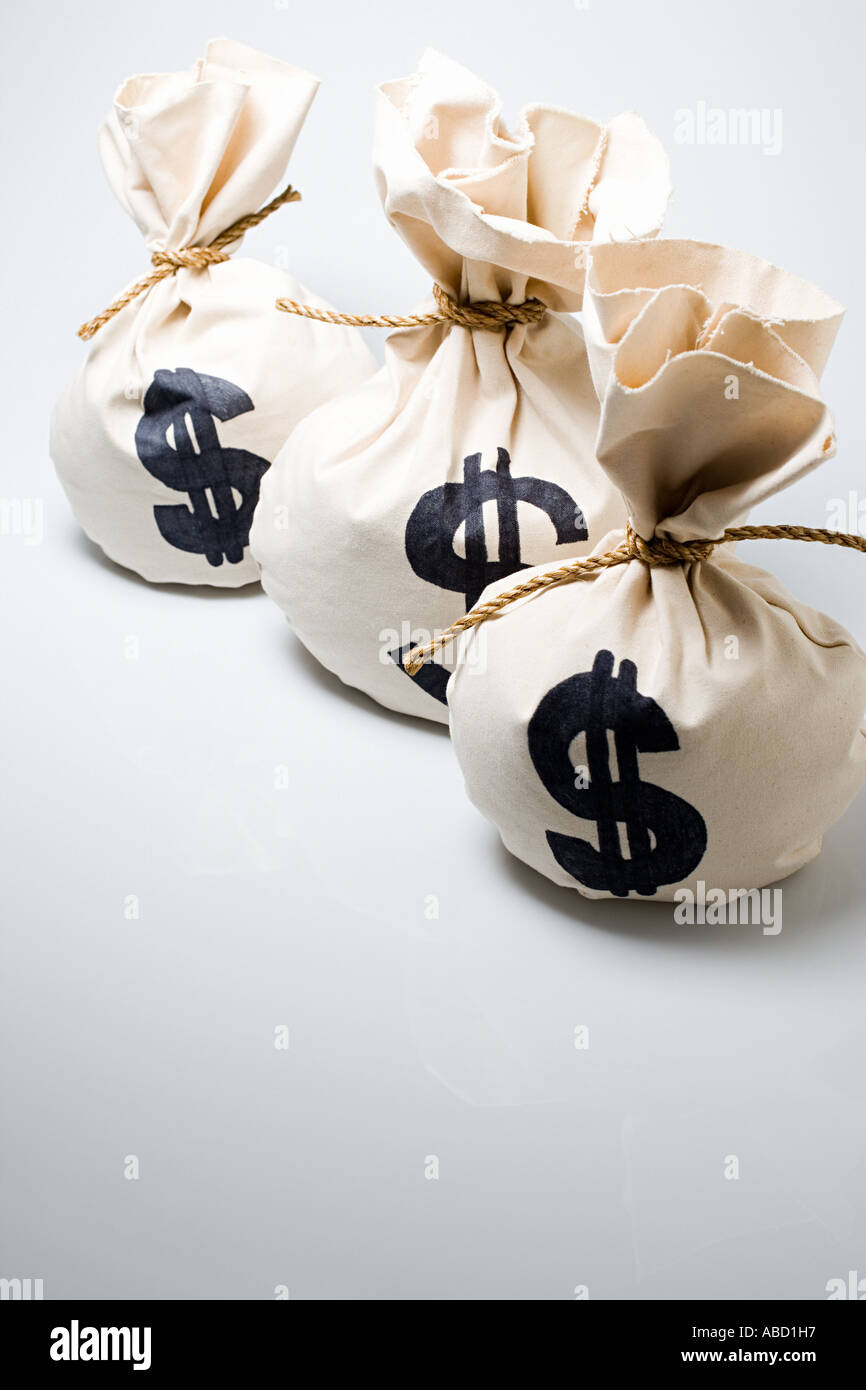 Three bags of money Stock Photo - Alamy