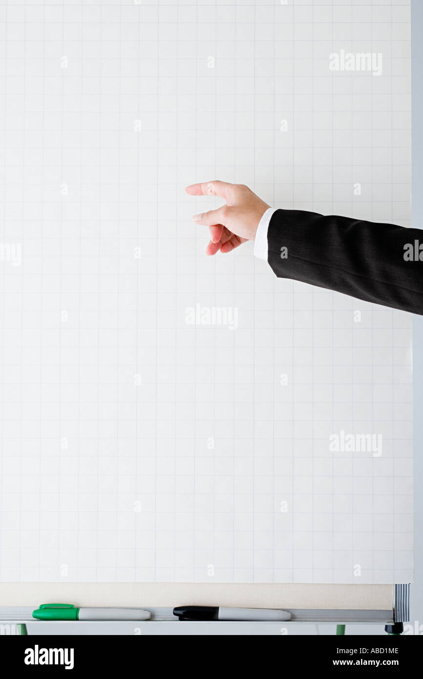 Pointing at a flipchart Stock Photo - Alamy