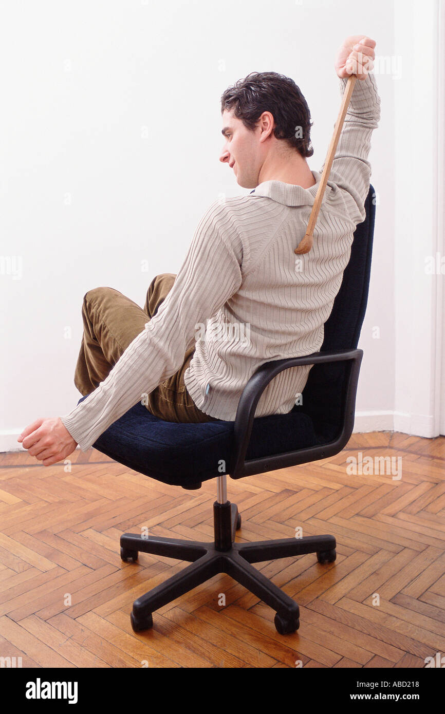 Man scratching back Stock Photo - Alamy