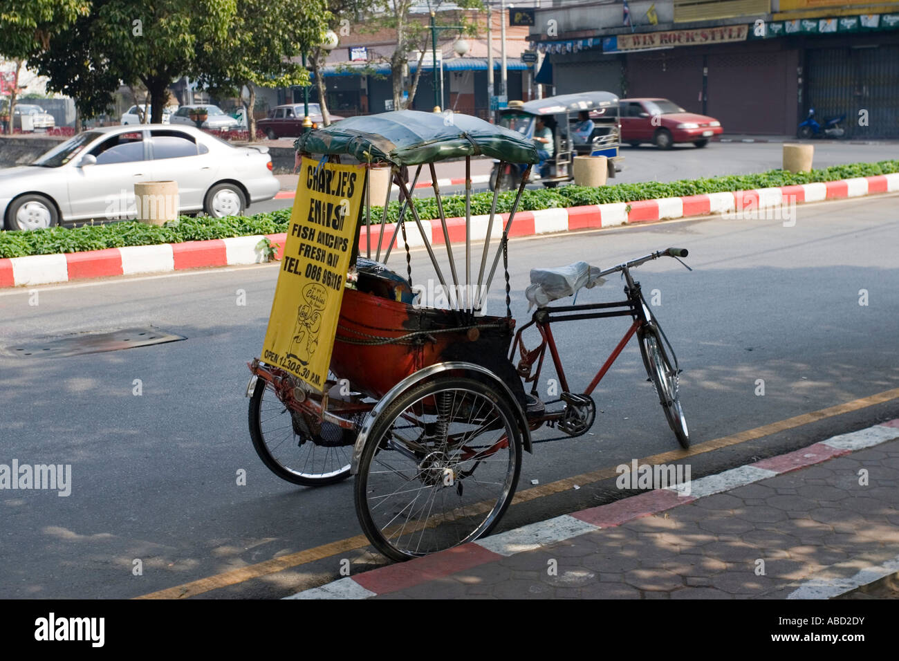 Old fashioned rickshaw with fish and chips advertising Chiang Mai north ...
