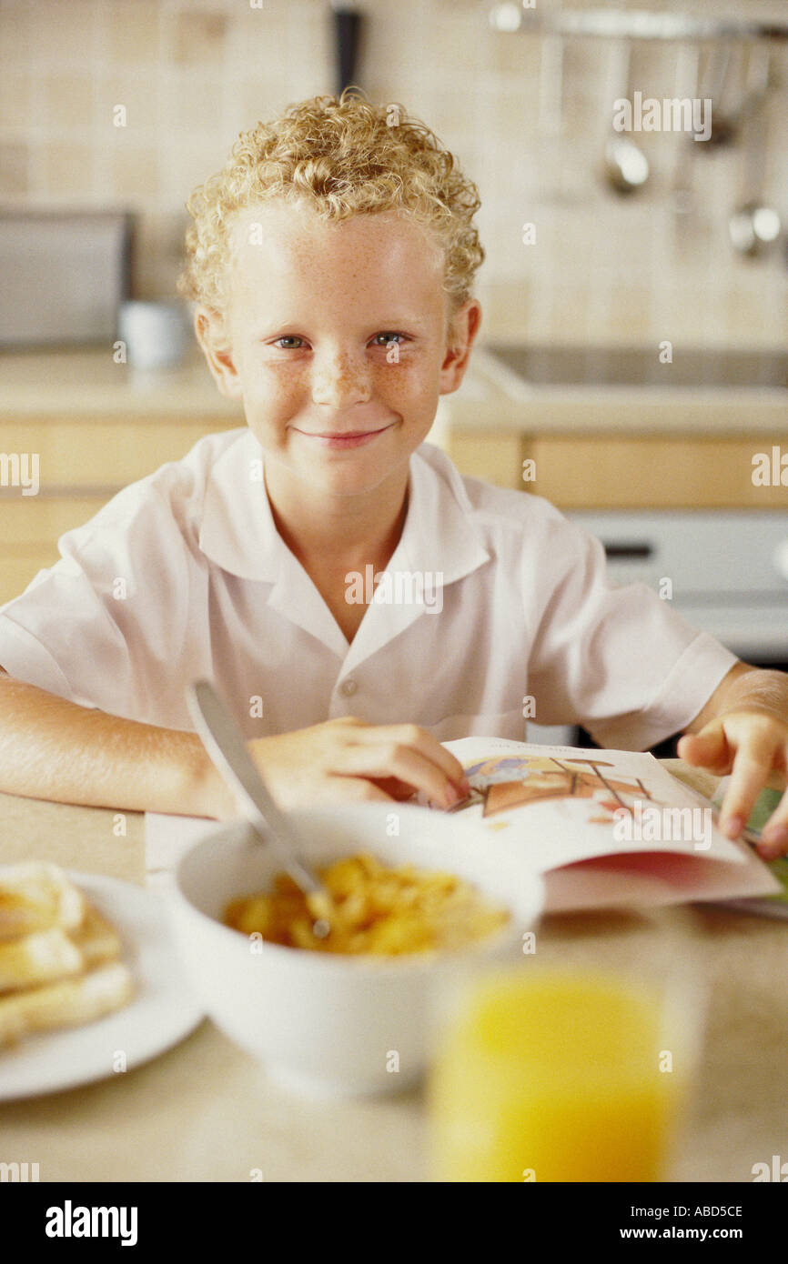 Boy having breakfast Stock Photo - Alamy