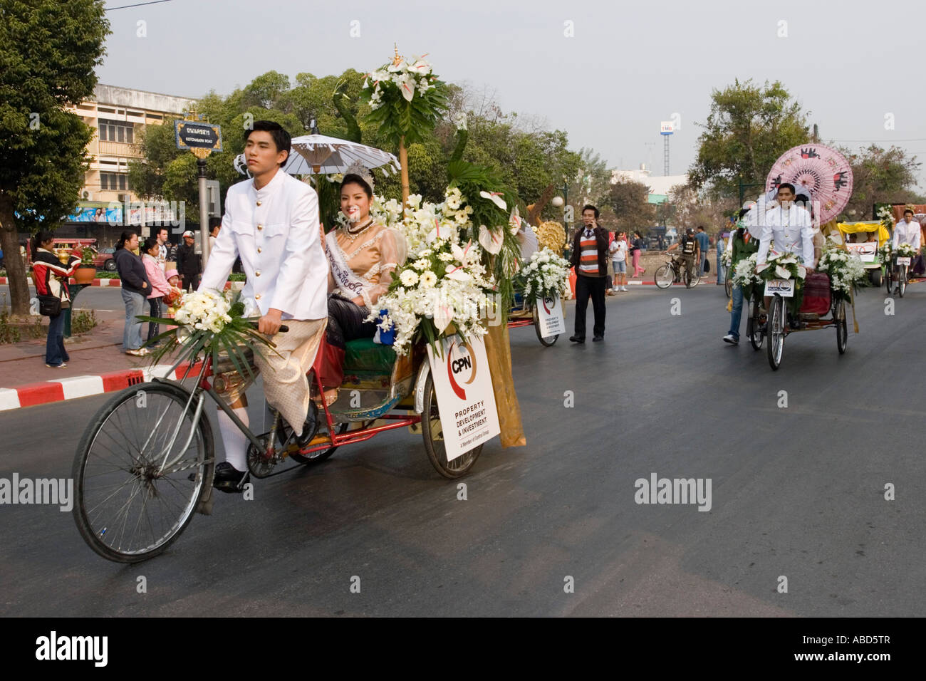 Rickshaw tricycle with floral display and beauty contestant parade ...