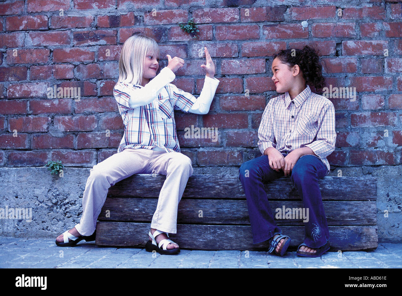 Girls talking outside Stock Photo - Alamy