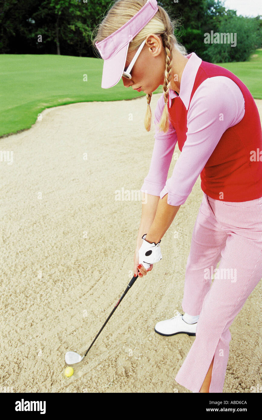 Woman playing golf Stock Photo - Alamy