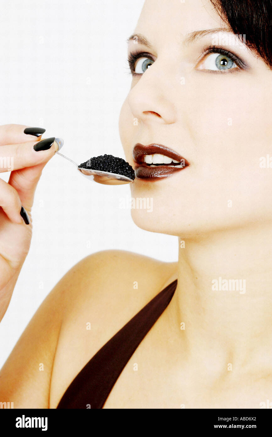 Woman eats caviar hi-res stock photography and images - Alamy