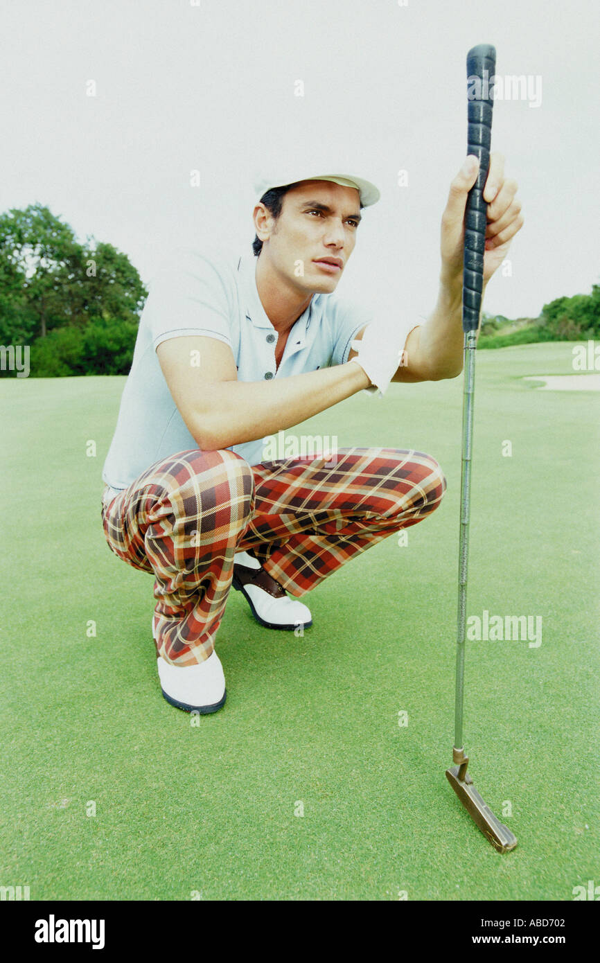 Man playing golf Stock Photo - Alamy