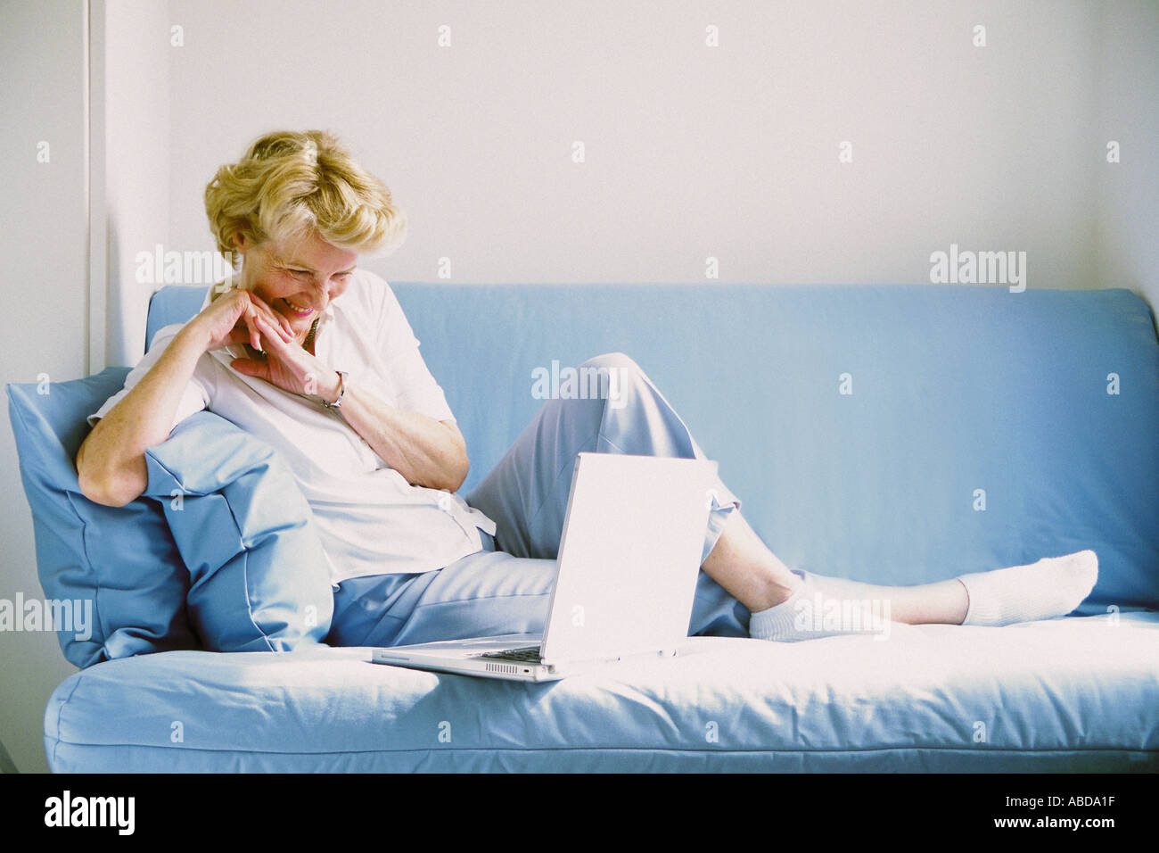 Woman using laptop computer Stock Photo - Alamy