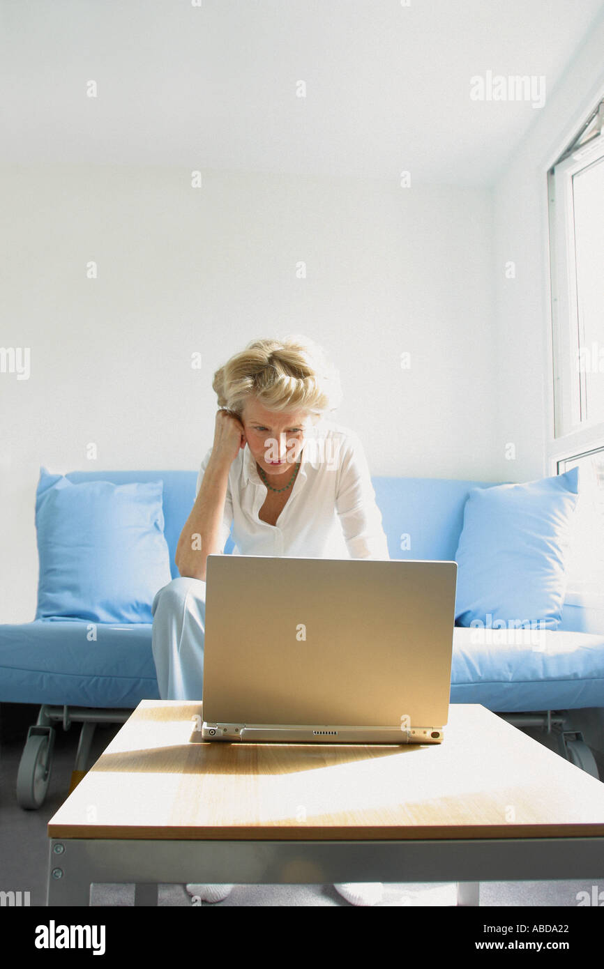 Woman using laptop computer Stock Photo - Alamy